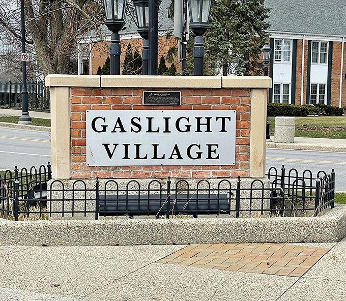 Signage: The iconic Gaslight Village entrance marker stands sentinel, welcoming visitors to this pocket-sized commercial district with old-fashioned charm.