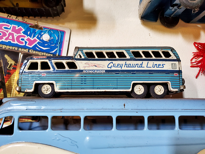 A vintage Greyhound Scenicruiser toy bus that probably carried the miniature dreams of some 1950s kid who imagined cross-country adventures.