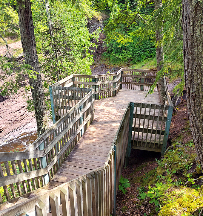 Thoughtfully designed boardwalks guide visitors safely along the trail's edge, proving that wilderness adventures don't require superhero hiking abilities.