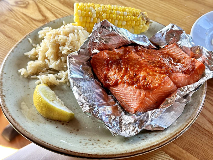 The Black and Bleu Salmon arrives like a work of art &ndash; perfectly seared, nestled beside fluffy rice and sweet corn, with a lemon wedge for that essential citrus zing.