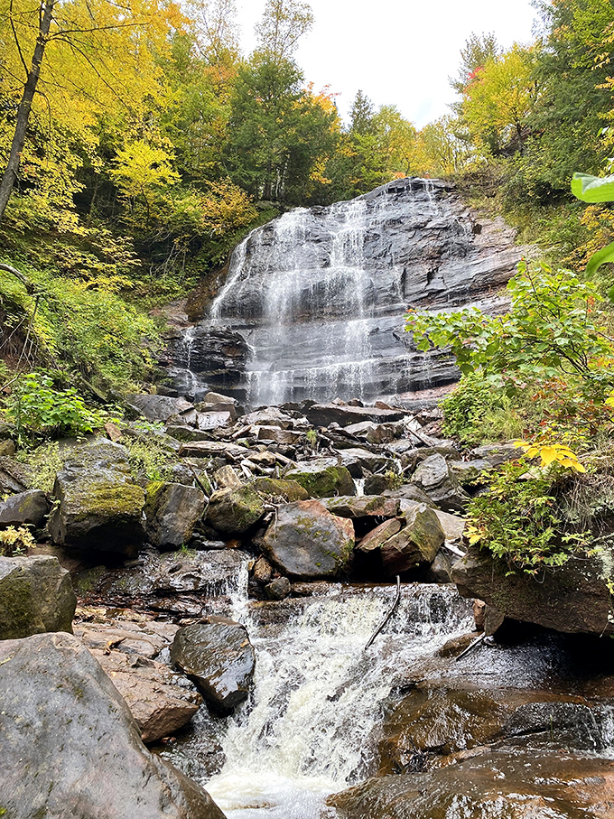 Fall's fiery palette transforms Hungarian Falls into a kaleidoscope of color, where every leaf competes to outshine the cascading water.