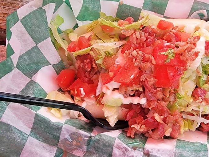 The BLT Dog brings garden-fresh toppings to the party, proving that sometimes the simplest combinations create the most satisfying bites.