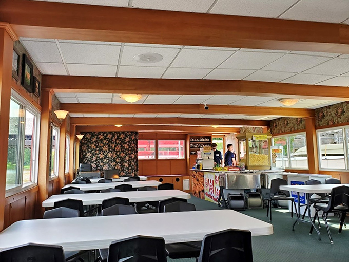 The riverboat's interior cabin offers cozy refuge with wood-paneled warmth &ndash; like your grandpa's den, but floating and with better views.