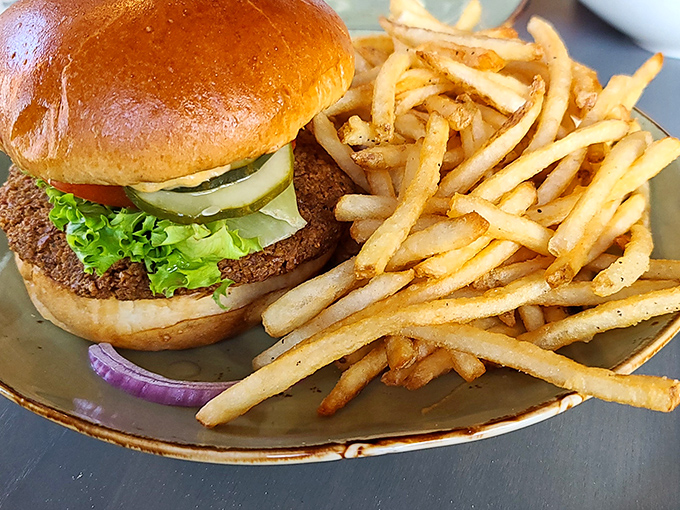 This isn't just any burger – it's a hand-formed masterpiece nestled in a pillowy bun with fresh lettuce and crisp pickles that puts fast food to shame.