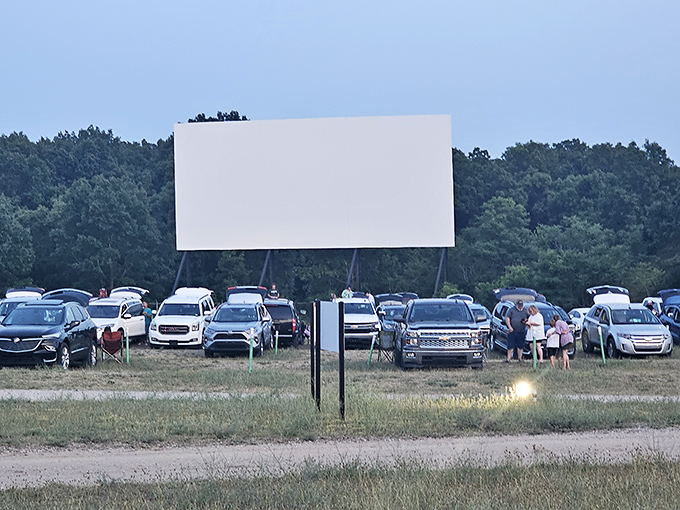 Families and friends create their own viewing spaces, each car a private theater with the best company you could ask for.