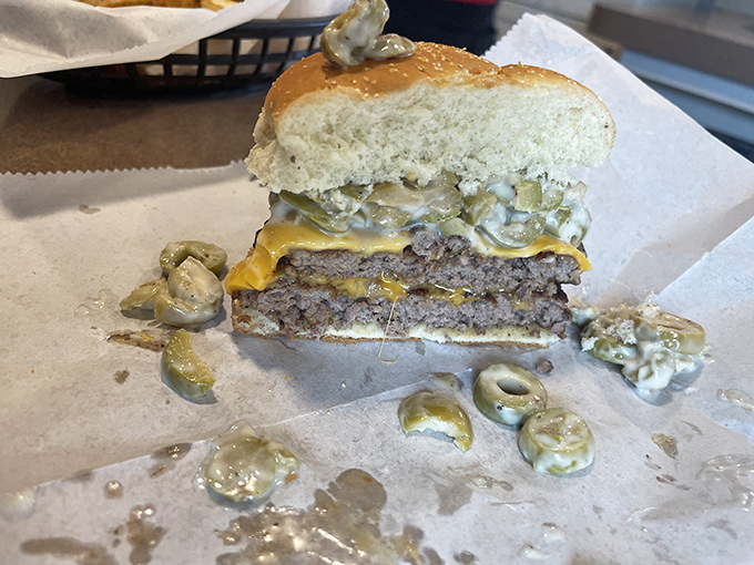 The Double Olive Burger showcases Michigan's unique regional specialty &ndash; those tangy green olives mixed with mayo create a flavor combination that's absolutely addictive.