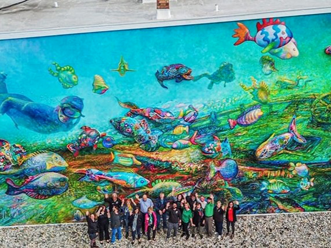 Viewed from above, the full scope of this aquatic masterpiece reveals itself – a symphony of color against small-town brick.