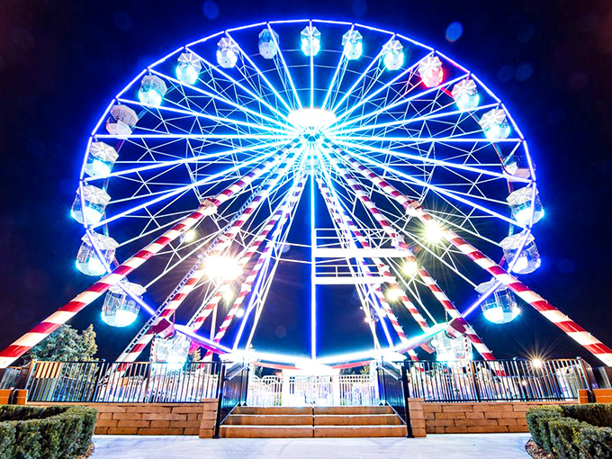 As day turns to dusk, the Ferris wheel becomes a kaleidoscope of light, painting the night sky with circles of joy.