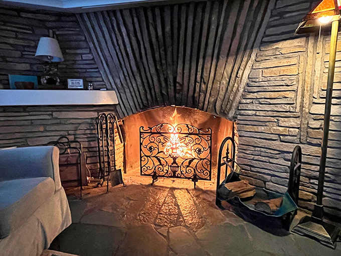 Not just a fireplace, but the beating heart of this hobbit home, promising warmth and wonder on chilly Michigan evenings.