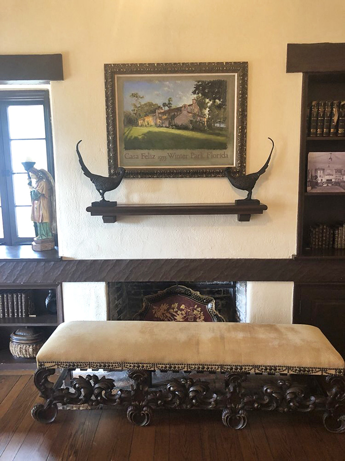 Even the fireplace radiates Mediterranean charm, because apparently someone decided Florida winters required Spanish-style heating solutions despite our tropical location.