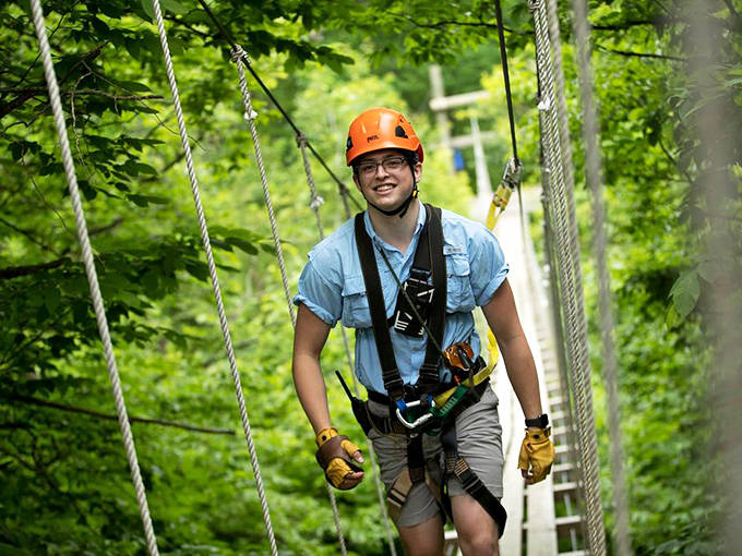 Between earth and sky, this explorer finds the sweet spot of adventure, suspended in a moment of pure freedom among the forest canopy.