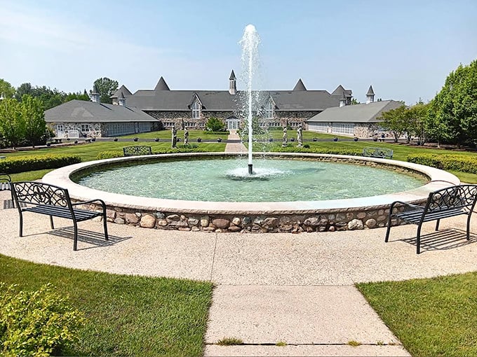 A serene fountain creates nature's soundtrack in the castle courtyard, hypnotizing visitors into forgetting they're still in Michigan.