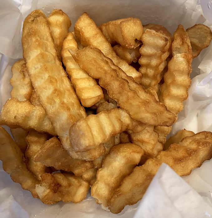 Golden, crispy crinkle-cut fries that achieve the perfect balance, crunchy exterior, fluffy interior, and just enough salt to make them irresistible.