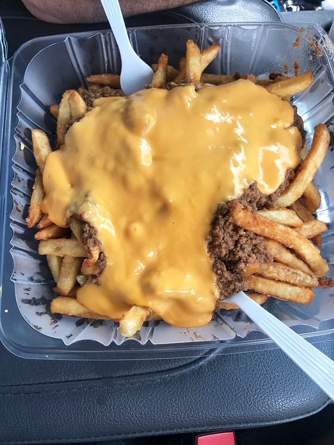 Chili cheese fries that require both a fork and a strategy, comfort food that makes diet plans disappear faster than the fries themselves.