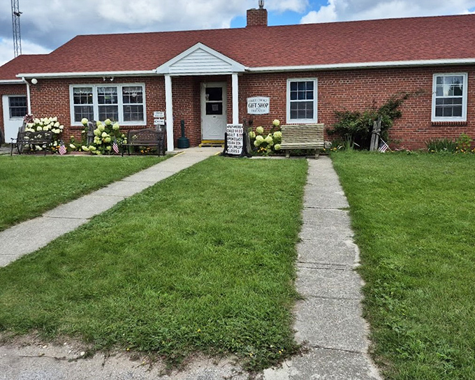 The humble gift shop welcomes visitors with maritime treasures and local crafts, supporting preservation efforts with every purchase.