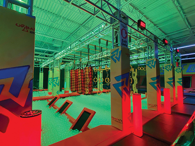 Neon-lit obstacle courses transform athletic challenges into something from a sci-fi movie &ndash; "Tron" meets "American Ninja Warrior."