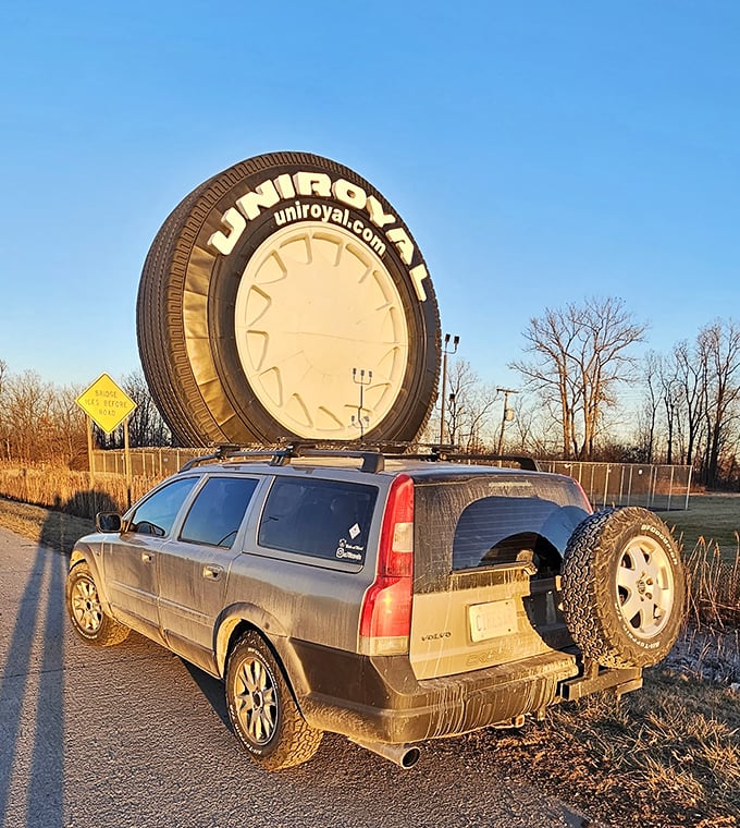 Golden hour transforms the world's largest tire into a silhouette that would make any automotive enthusiast weak at the knees.