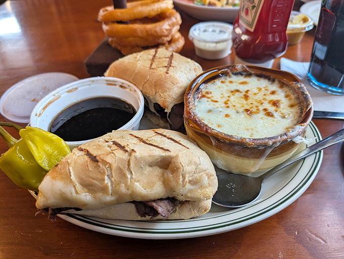 The perfect Michigan meal: a hearty sandwich alongside the legendary French onion soup that people drive hours to experience.