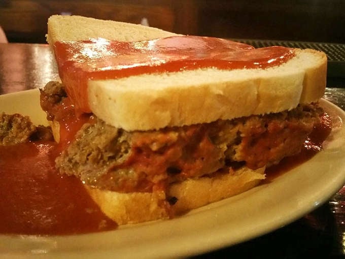 Homemade Meatloaf Sandwich: Comfort food perfection &ndash; thick slices of savory meatloaf smothered in rich tomato sauce between pillowy white bread.