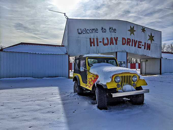 Even in winter's embrace, the Hi-Way's yellow Jeep stands guard, a splash of sunshine against the snow, waiting patiently for summer's return.