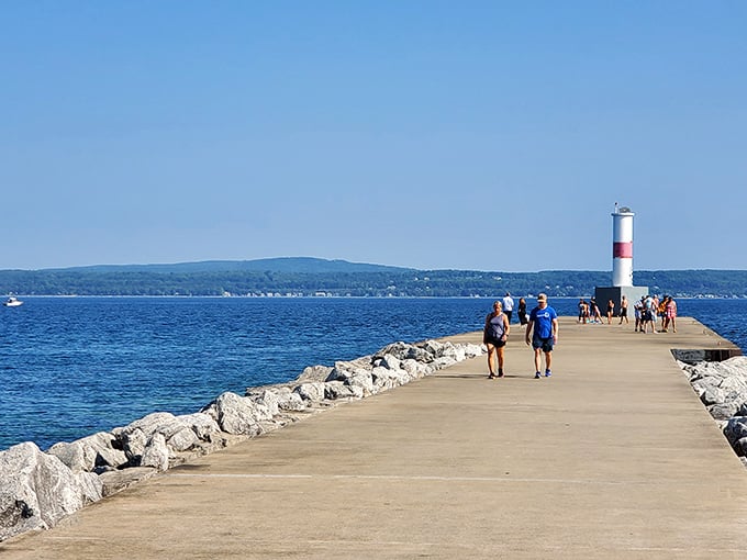 Petoskey's lighthouse stands sentinel at the breakwater's end, where walkers pause to feel Lake Michigan's refreshing spray on sun-warmed skin.