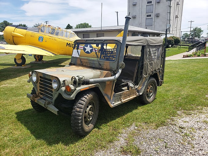 The humble military utility vehicle sits proudly alongside its flying counterparts, proving that not all heroes needed wings to serve their country.