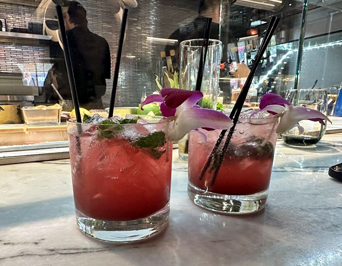 These aren't just cocktails; they're liquid postcards from paradise, garnished with flowers that weren't just thrown on as afterthoughts.