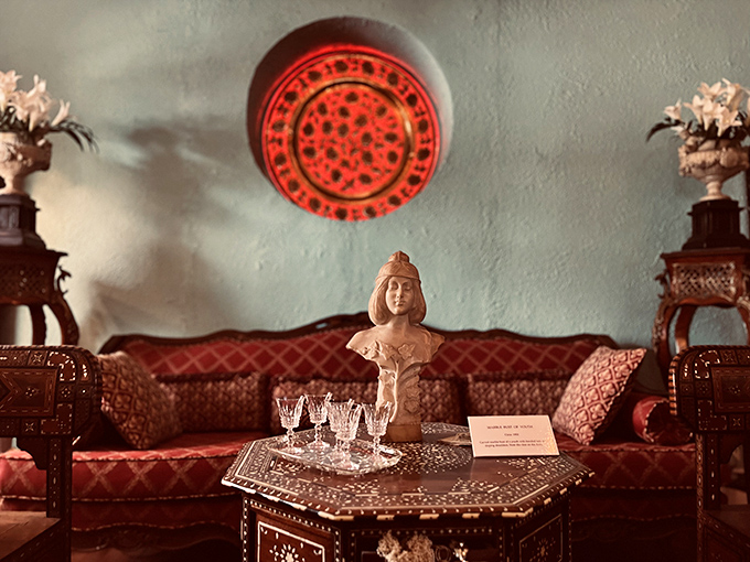 Marble Bust of Youth: This silent sentinel has witnessed decades of visitors, its stoic expression a stark contrast to the vibrant surroundings.