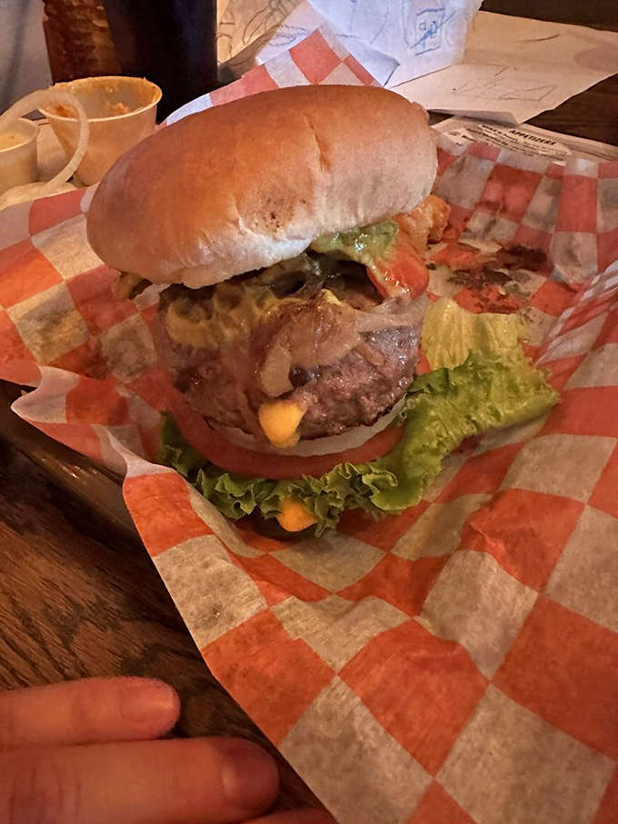 This isn't just a cheeseburger; it's a towering achievement of beef, cheese, and toppings that requires a strategic approach to eating.