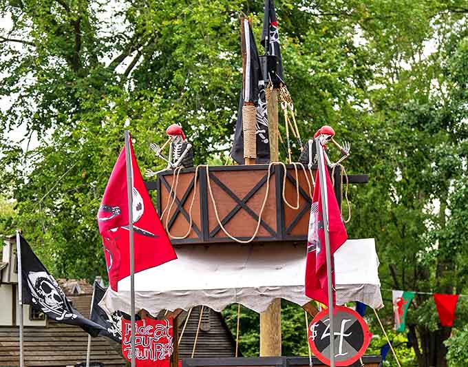 The "Pirate's Hunter" ship display features skeletal crew members standing watch, a macabre reminder of the dangers of medieval seafaring adventures.