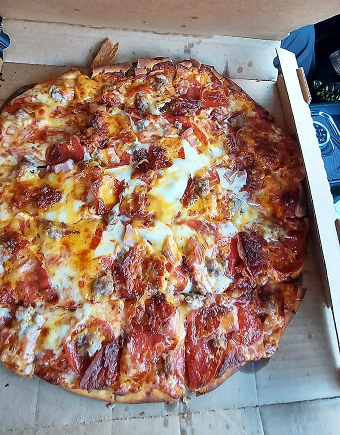 Pepperoni perfection &ndash; each slice at Jake's delivers that ideal balance of sauce, cheese, and toppings that keeps locals coming back.