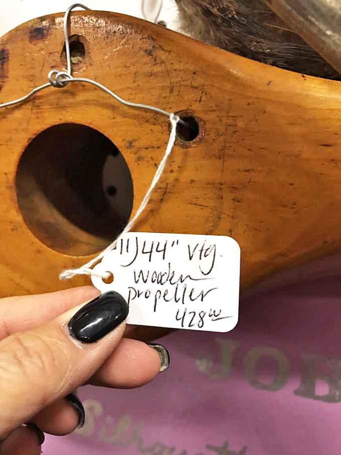 Each handwritten price tag tells a story – this wooden propeller sailed through time to land in someone's collection for $28.