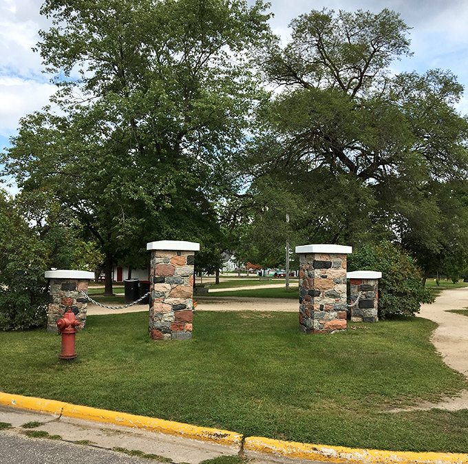 The antiques section dazzles with colorful glassware and delicate treasures, arranged with care under soft lighting that makes each piece sparkle with history.
