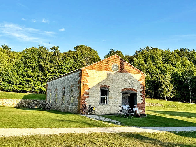 Sunlight plays across this restored limestone building, its sturdy walls holding secrets of craftsmen who built for the ages.