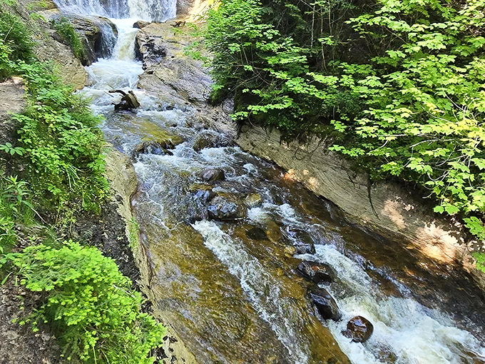 Nature's symphony in motion &ndash; cascading waters carve through ancient rock in a timeless dance of persistence.