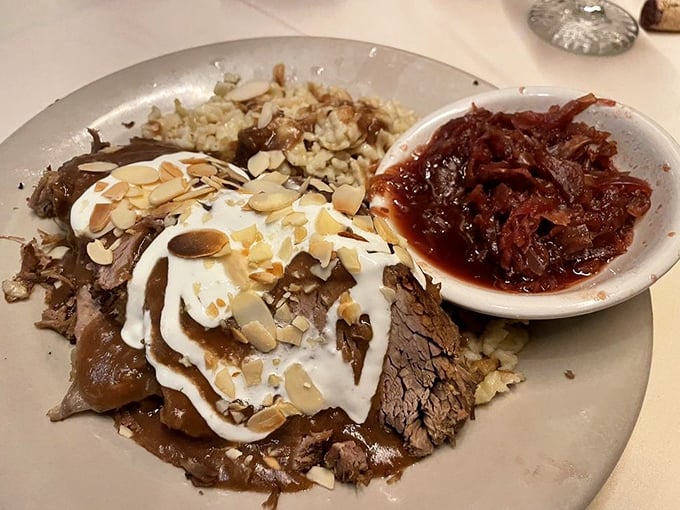 Sauerbraten: Fork-tender beef that's been marinated for days, topped with sour cream and almonds – this isn't just pot roast, it's a German masterpiece.