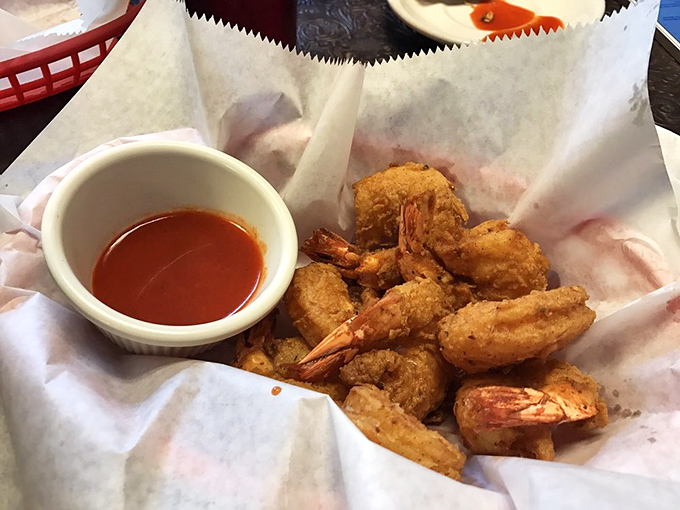 These crispy shrimp have dressed for the occasion, wearing a seasoned coating that shatters with each bite &ndash; the dipping sauce is their perfect dance partner.
