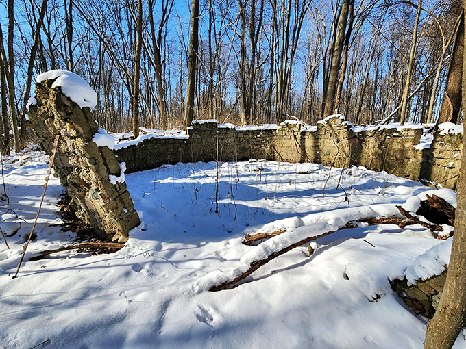 Stone remnants whisper stories of former lives, leaving us to wonder: whose hands stacked these walls long ago?