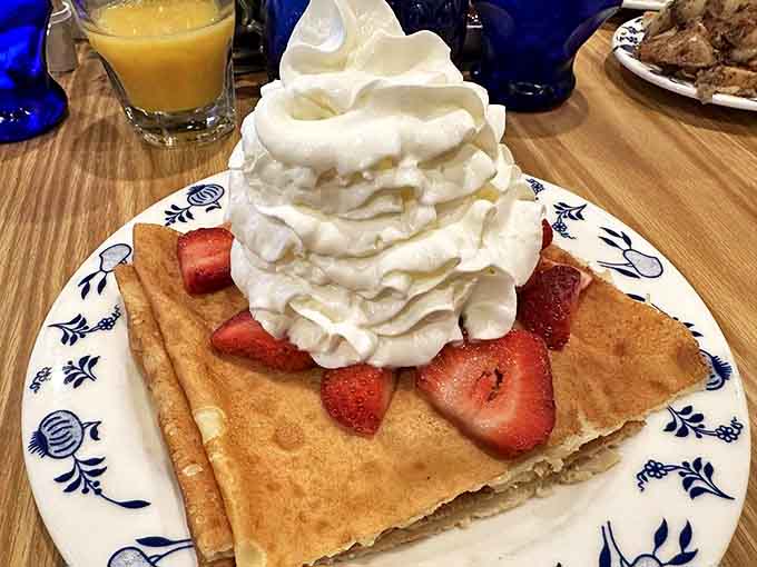 Swedish pancakes: Thin, golden perfection topped with fresh strawberries and a mountain of whipped cream that would make ABBA sing with joy.