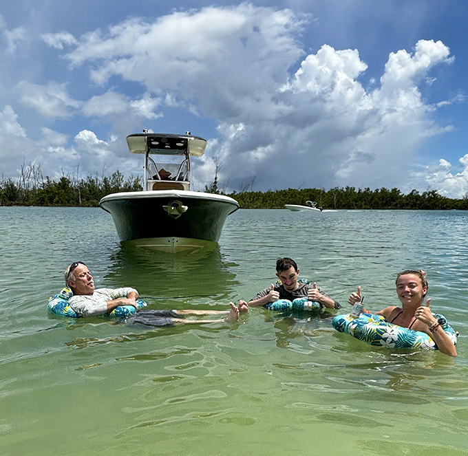 Floating in paradise with cold drinks in hand &ndash; because hydration is important when you're busy doing absolutely nothing.