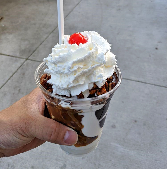 The legendary Tommy Turtle in all its glory, a mountain of vanilla soft serve smothered in hot fudge, caramel, and pecans.