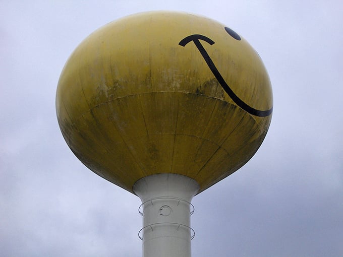 Weather and time have added character to this smiling sentinel, its yellow face bearing the patina of decades spent watching over Fruitport.