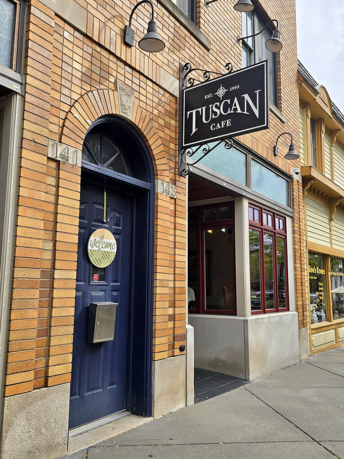 The Tuscan Cafe's warm brick exterior promises what awaits inside: coffee worth lingering over and conversations worth having.