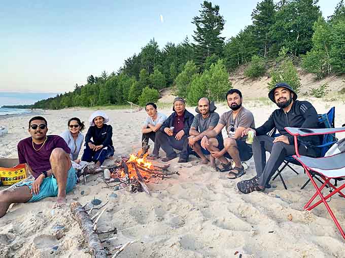 Nothing says "vacation done right" like a beach bonfire with friends, where stories flow as freely as the waves.