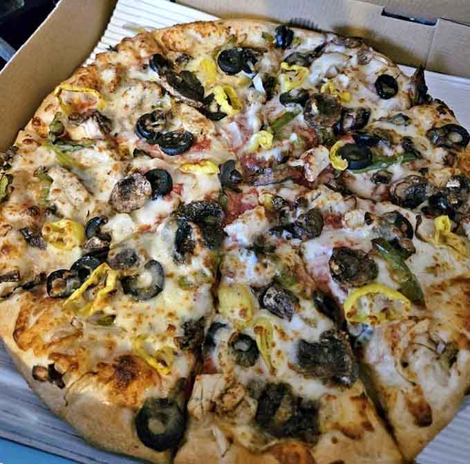 The veggie pizza proves eating your greens can be totally awesome when they're nestled on a perfect crust with melty cheese and savory sauce.