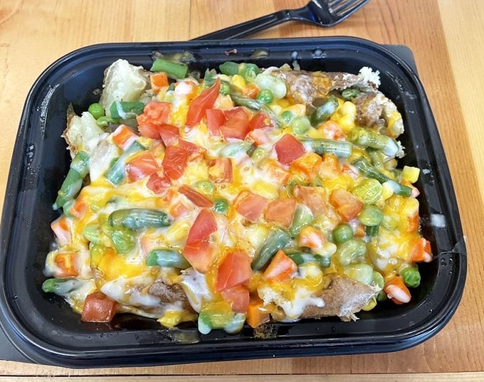 A veggie lover's dream come true &ndash; this colorful masterpiece turns a simple spud into a garden party with every bite offering new flavor combinations.