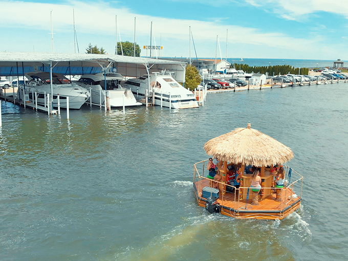 The marina stretches out like a nautical neighborhood, with sailboats playing the role of sophisticated neighbors watching the tiki boats throw the best parties.
