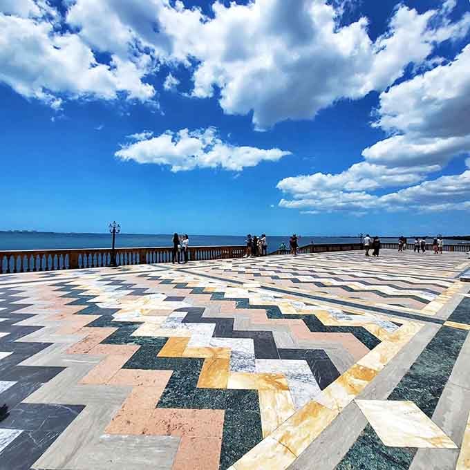 Visitors stroll the waterfront terrace where 1920s yacht parties once raged, and the ghosts of jazz music still float on the breeze.