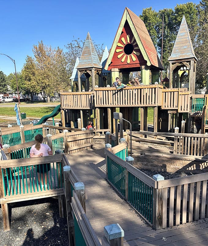 Young adventurers navigate wooden walkways and platforms, their expressions of concentration and delight capturing the essence of imaginative play.