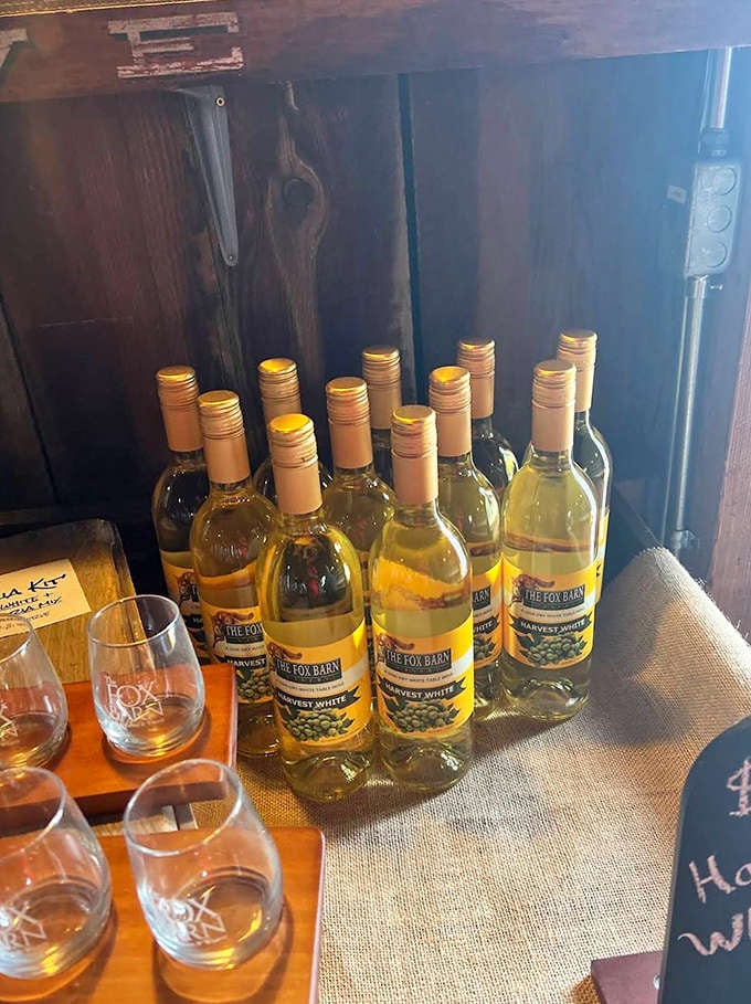 Bottles of Harvest White stand at attention, their pale gold contents promising crisp, fruit-forward sips perfect for summer afternoons.